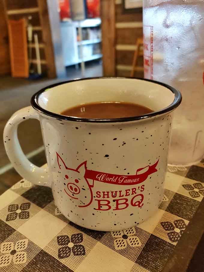 Even the coffee comes with personality, served in a mug that proudly declares this place's world-famous status.