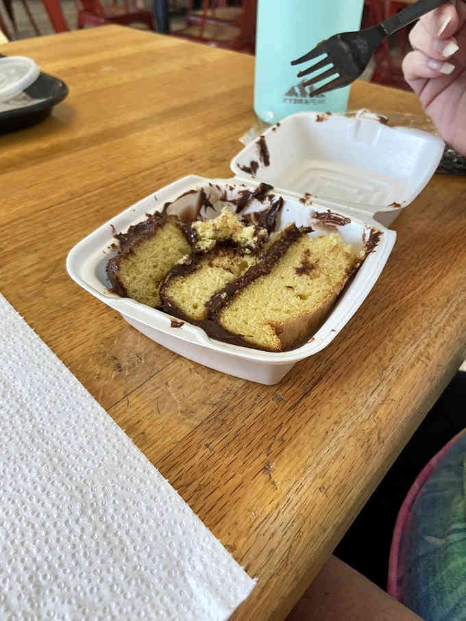 Because even barbecue temples understand that chocolate cake is a legitimate food group worth celebrating properly.