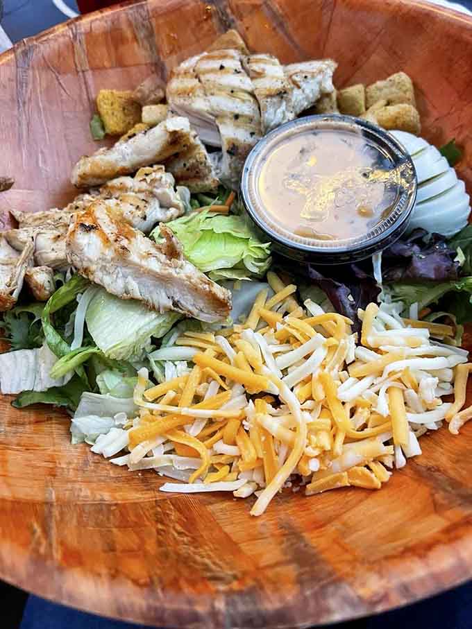 Fresh greens topped with grilled chicken prove that even blues bars know how to treat the health-conscious crowd right.