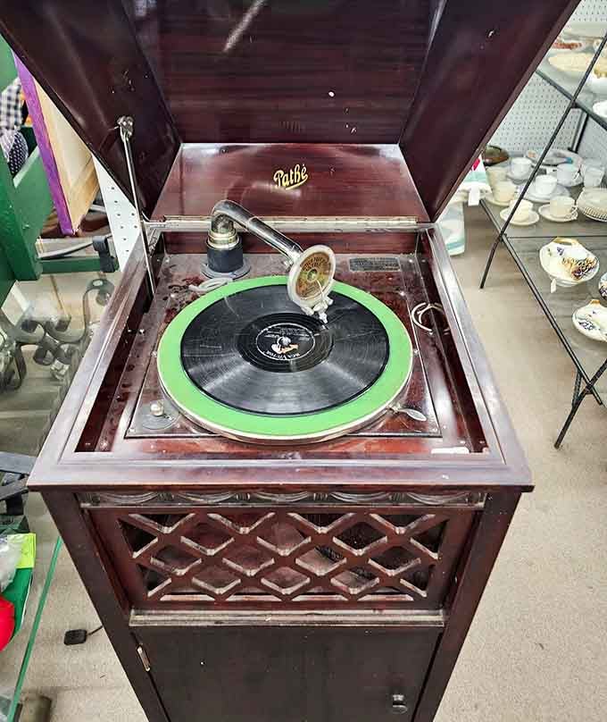 This Pathé record player once brought music to living rooms before streaming existed, when album covers were actual art.