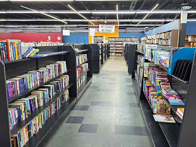 Books stacked like literary treasure chests, where your next favorite read costs less than your morning coffee run combined.