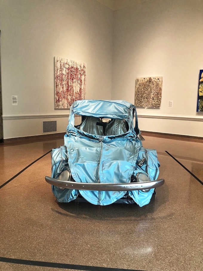 That shiny blue vintage car sculpture makes you wonder if Salvador Dal&iacute; ever tried his hand at automotive design.