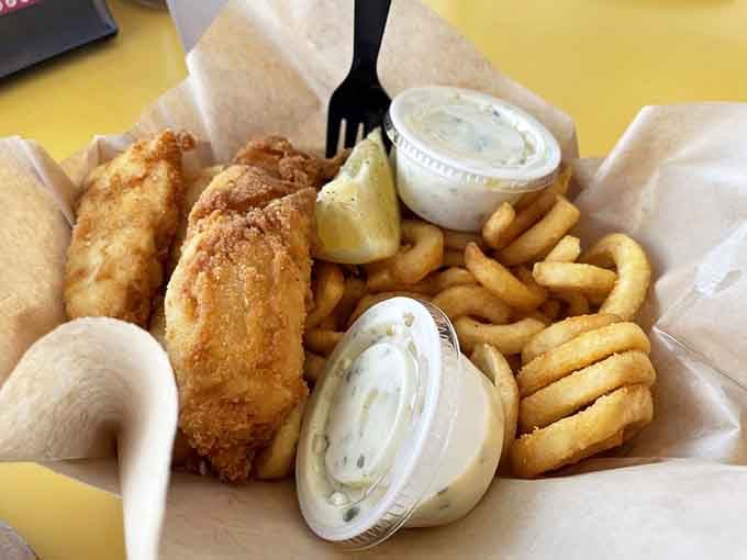 Golden fried cod and curly fries deliver exactly what your beach-hungry soul needs after hours in the sun.
