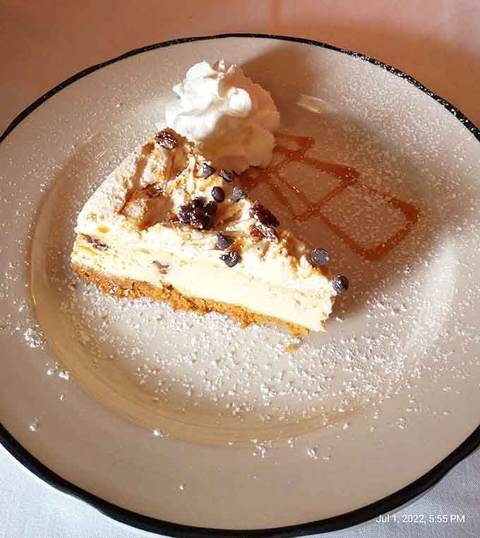 Cheesecake dusted with powdered sugar and drizzled with caramel; dessert just became your main course.