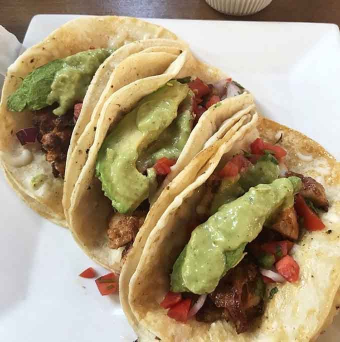 Blackened chicken tacos topped with creamy avocado, bringing a little southwest flair to this Midwestern church-turned-brewery.