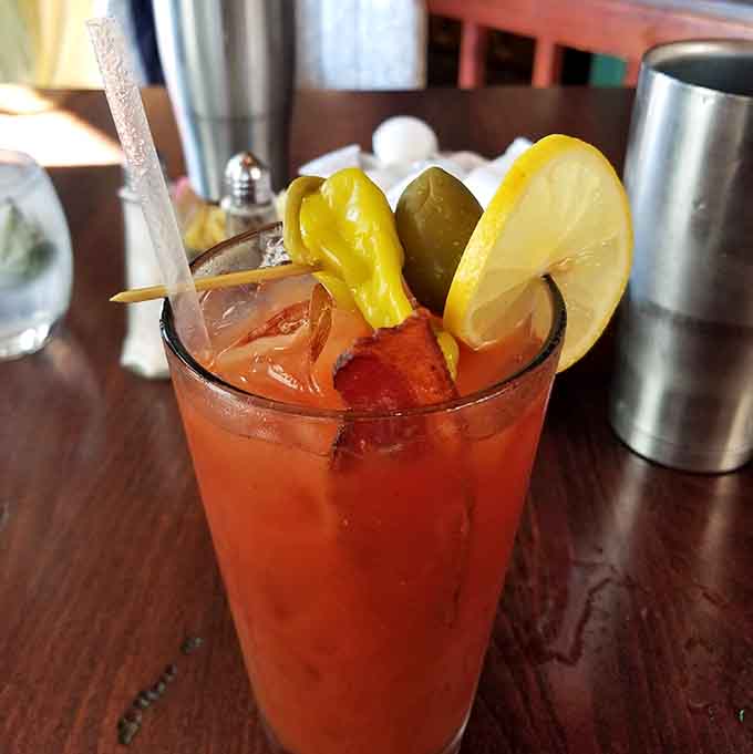 A Bloody Mary so loaded with garnishes it's practically a salad, a cocktail, and an appetizer having a party.