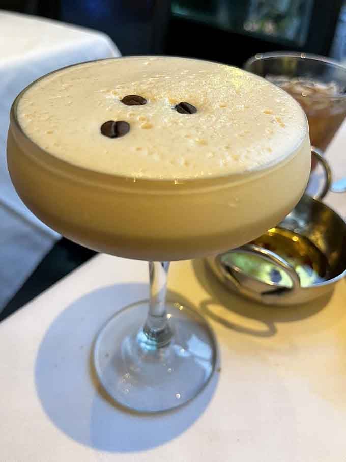 Three coffee beans floating atop a frothy espresso martini is the sophisticated pick-me-up your evening didn't know it needed.