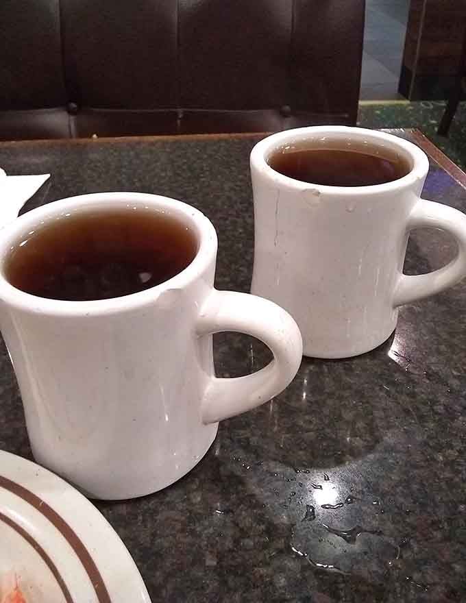 Two cups of hot tea, the perfect pause button between your third and fourth trips to the buffet stations.
