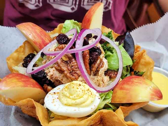 A salad so beautifully composed it deserves its own display case, complete with apple slices and eggs.