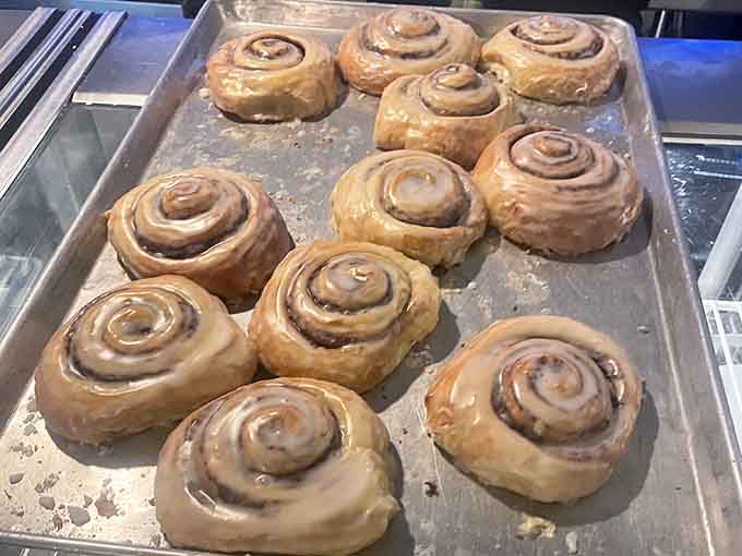 Fresh cinnamon rolls so perfect they could make a grown adult weep tears of pure joy and sugar.