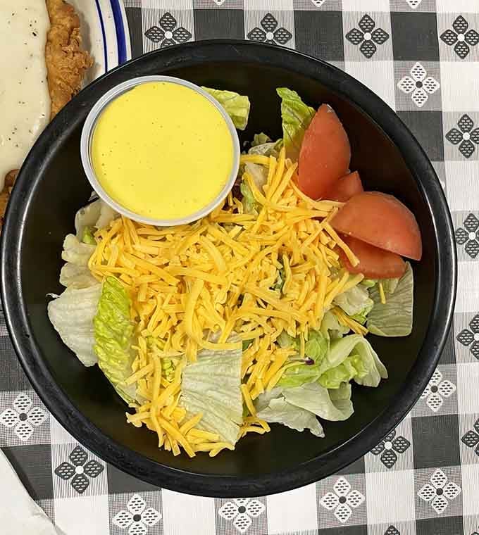 Simple iceberg lettuce topped with shredded cheddar becomes something more when served with genuine Midwestern hospitality and care.