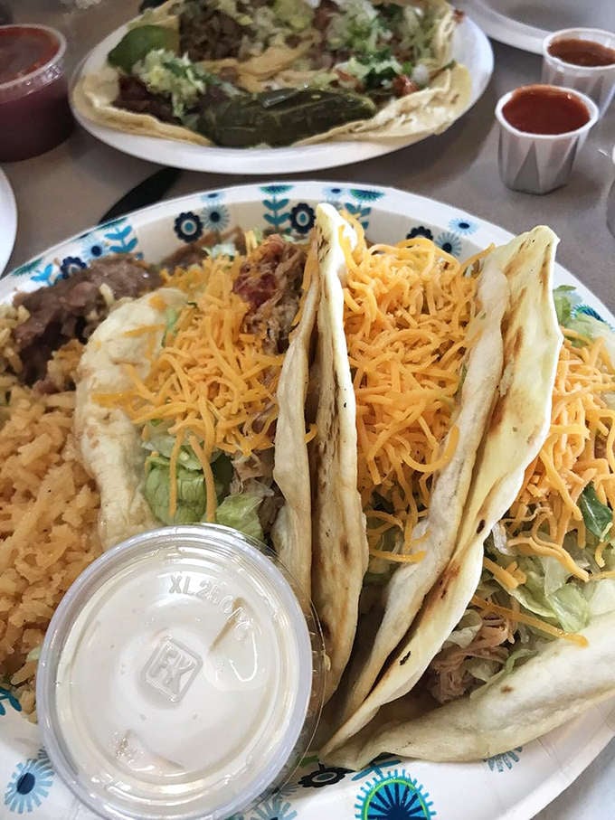 Hard shell tacos loaded with cheese and meat, proving that sometimes crunchy is absolutely the right answer.