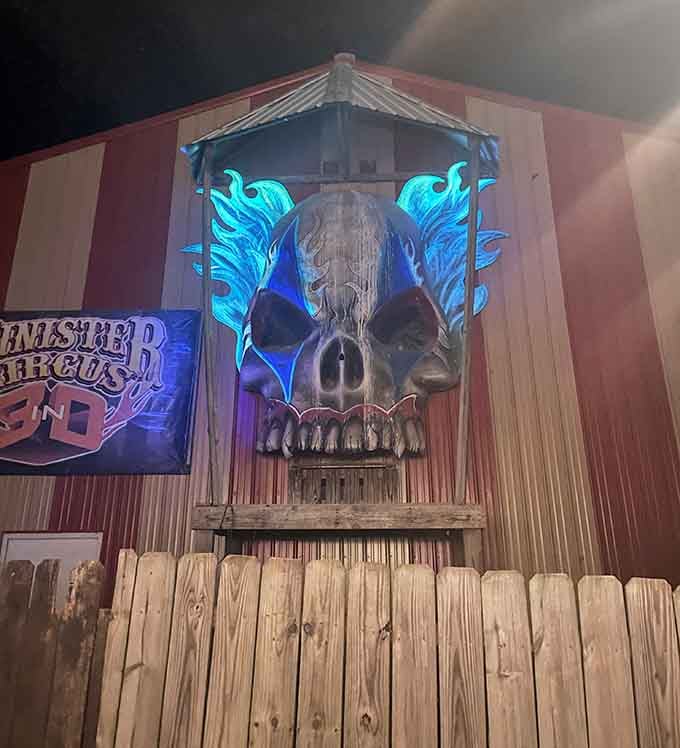 Rusty old trucks and a haunting sign mark the entrance to thrills and chills waiting ahead.