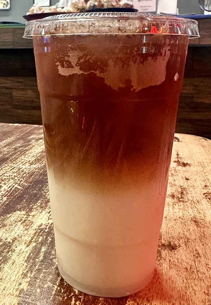 The layered horchata drink looks like a sunset in a cup, sweet and refreshing enough to cool any desert day.