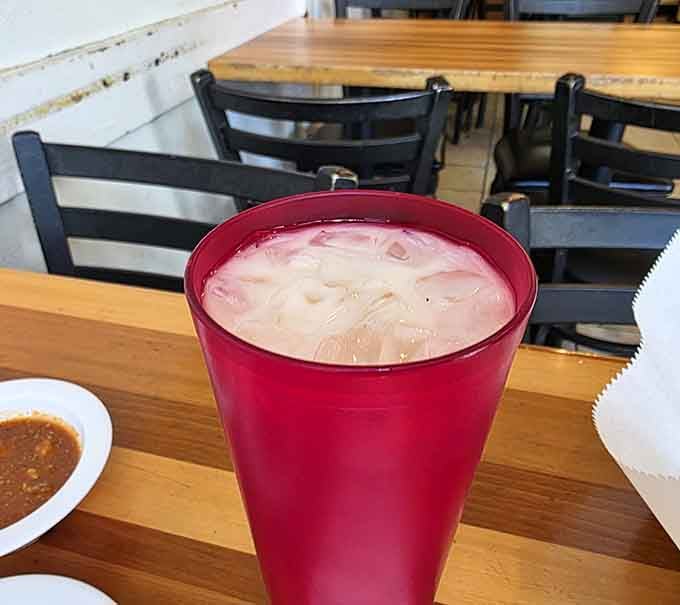 Even the horchata comes in a cheerful red cup, because apparently everything here is determined to make you smile.