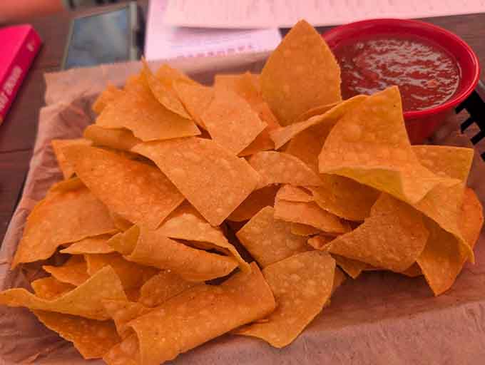 Golden tortilla chips and house-made salsa, the opening act that somehow rivals the headliner every single time.
