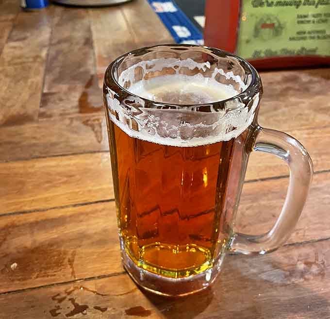 A frosty mug of beer because sometimes burgers need a proper companion, not just a supporting actor in your meal.