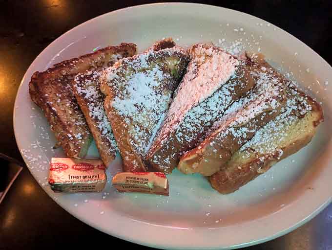 French toast dusted with powdered sugar looks like breakfast won the lottery, sweet and utterly irresistible always.