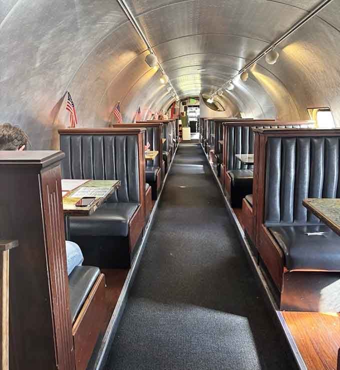 The curved fuselage ceiling reminds you that you're dining in aviation history, minus the crying babies and beverage carts.