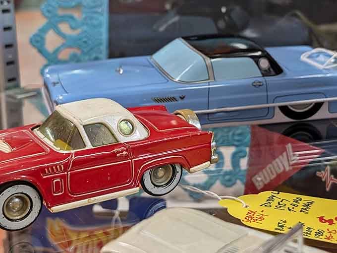 Vintage tin toy cars gleaming like miniature time machines, ready to transport you straight back to childhood Christmas mornings.