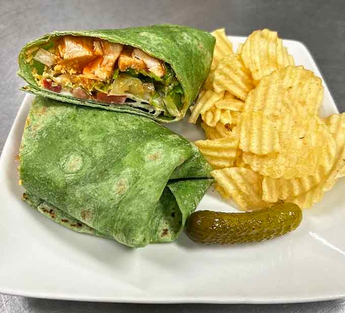 That green wrap packed with chicken and veggies looks like it walked straight out of a healthy eating magazine.