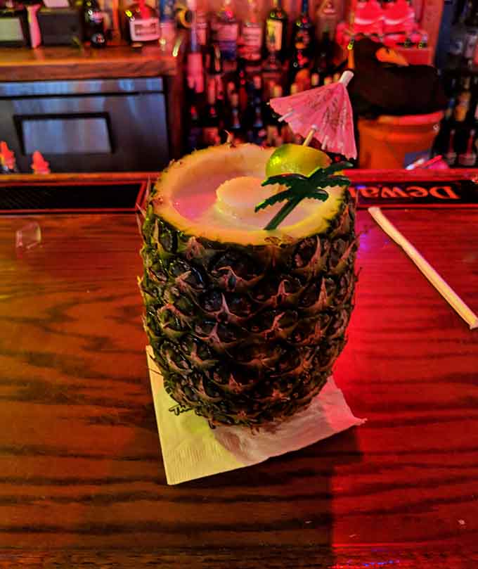 This piña colada served in an actual pineapple makes every other tropical drink look lazy by comparison.