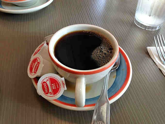 Coffee served in proper diner cups, the kind that get refilled before you even realize you need more.