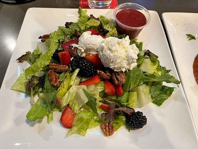 Fresh berries, candied pecans, and goat cheese transform greens into something your taste buds will actually celebrate.