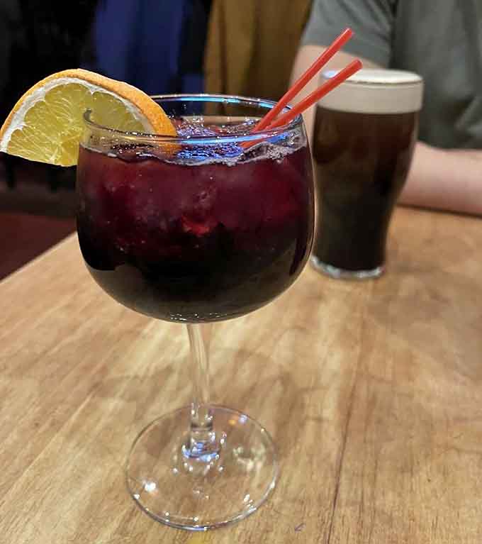 That sangria looks dangerously refreshing, the kind of drink that makes you forget you have responsibilities tomorrow.