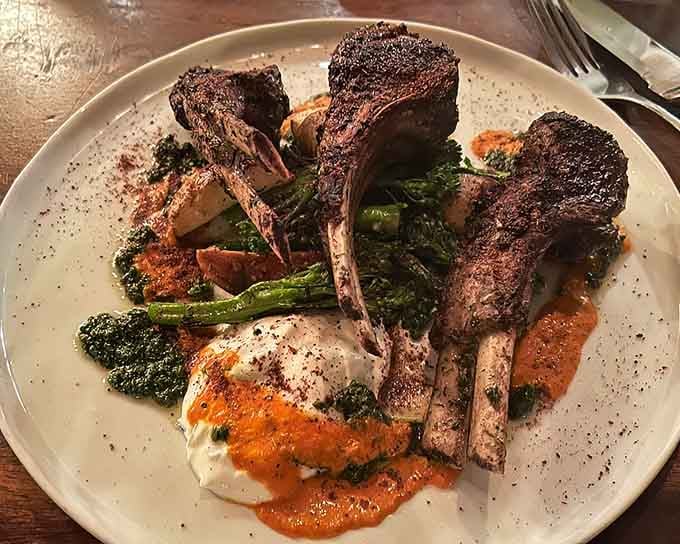 Lamb chops plated with vegetables showcase the kind of presentation that makes your camera eat first, naturally.