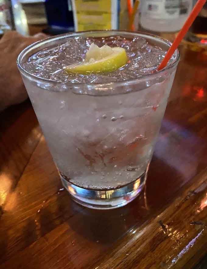 That perfectly clear cocktail with a lemon wedge looks refreshingly simple, like summer in a glass on any day.