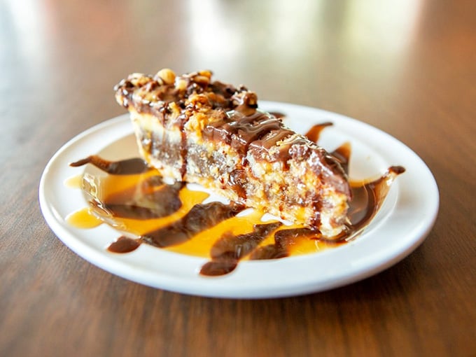 Turtle pie drizzled with chocolate and caramel because apparently heaven needed a dessert menu too, obviously.