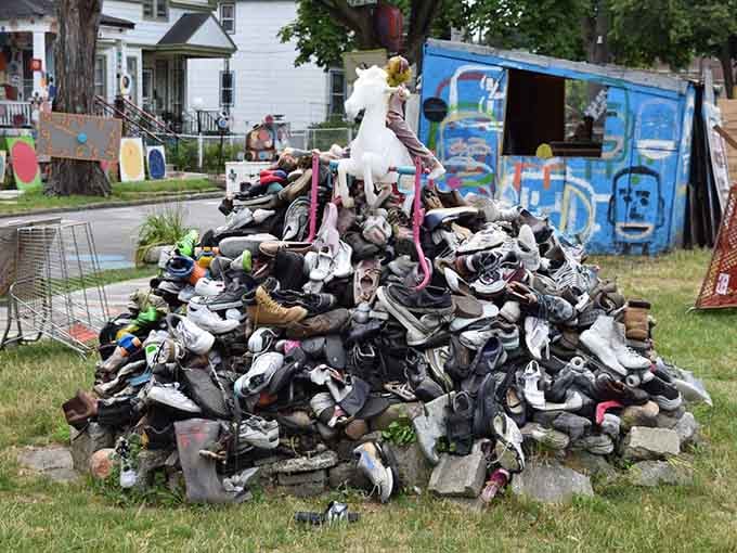 Hundreds of shoes create a mountain of stories, each pair representing journeys taken and miles walked together.