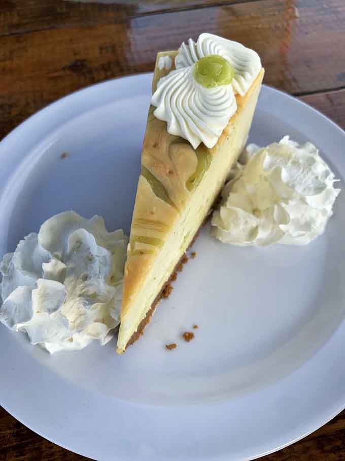 Key lime pie with whipped cream rosettes fancy enough to photograph, delicious enough to devour in three bites.