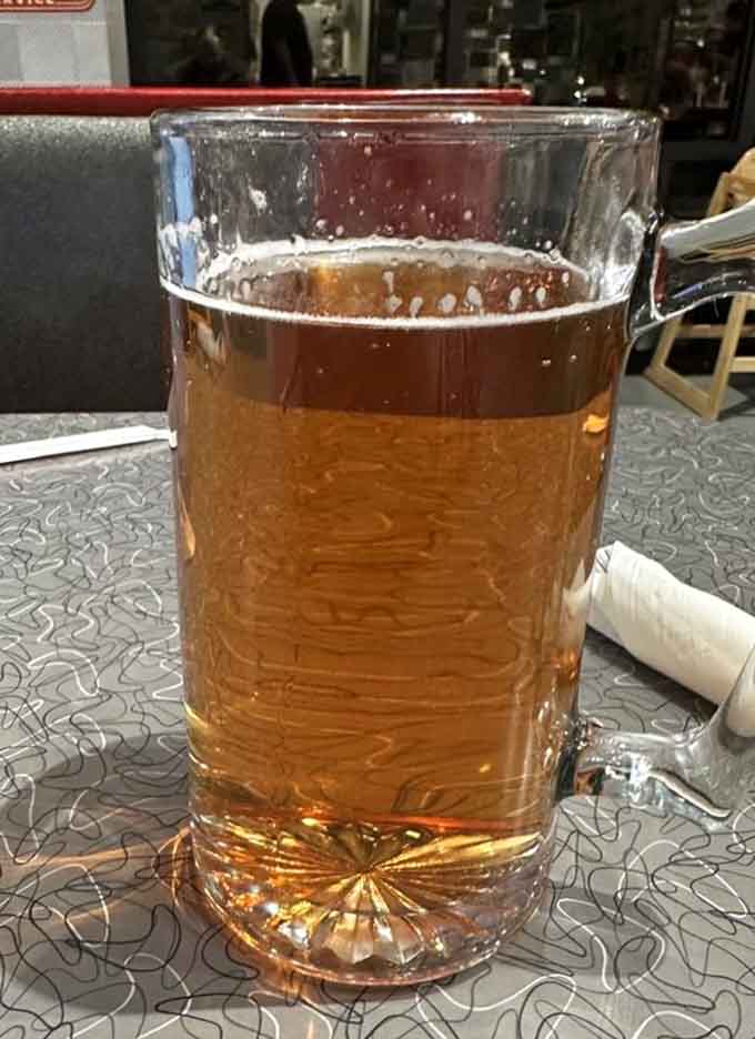 Ice-cold beverages in classic glassware complete the authentic diner experience with every refreshing sip.