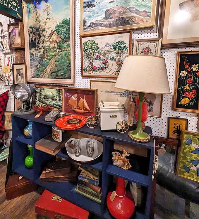 Framed paintings and colorful ceramics arranged like a museum where everything's actually for sale.