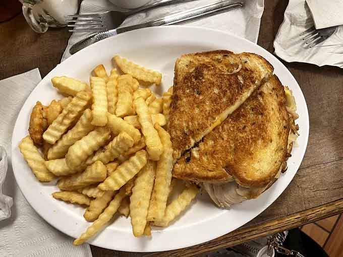A turkey Reuben grilled to perfection with crispy fries is the kind of lunch that makes you reconsider dinner plans.