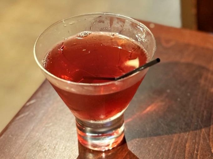 A perfectly mixed Manhattan, because even death-themed taverns know how to celebrate life with proper cocktails.
