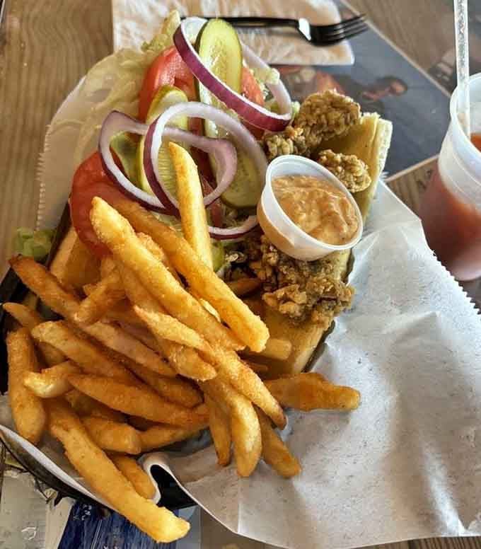 A po'boy this loaded requires both hands, a stack of napkins, and absolutely zero regrets whatsoever.