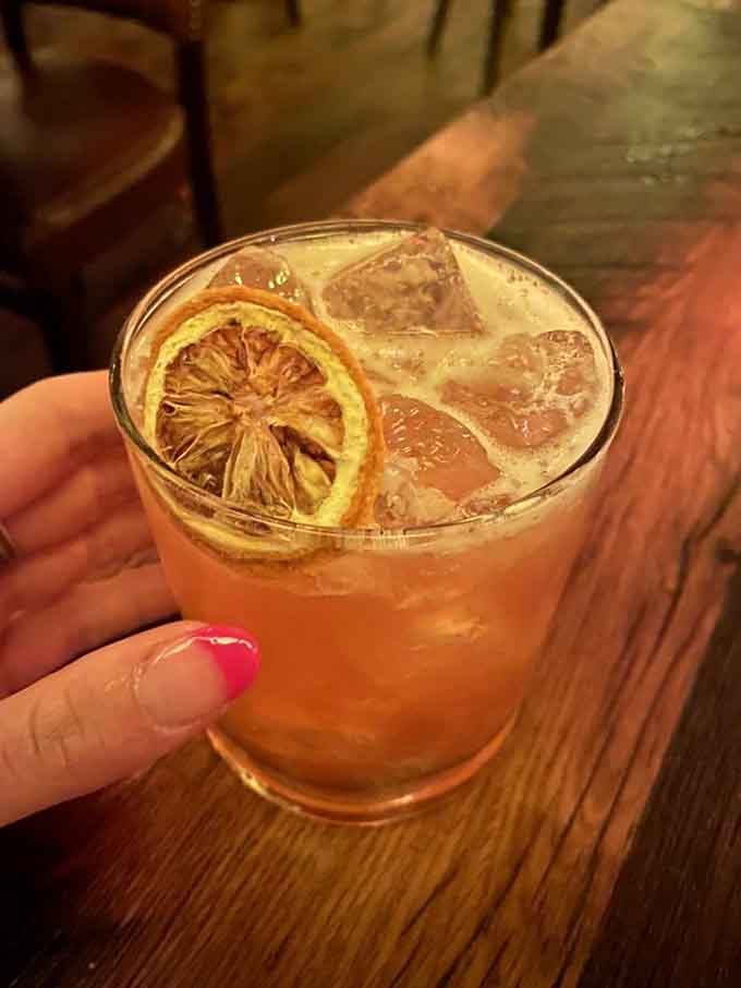 That dehydrated citrus wheel garnish tells you this cocktail is crafted with the same attention as the food.