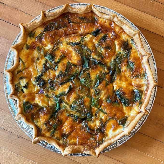 That golden quiche proves savory pies deserve equal billing in any respectable bakery display case today.
