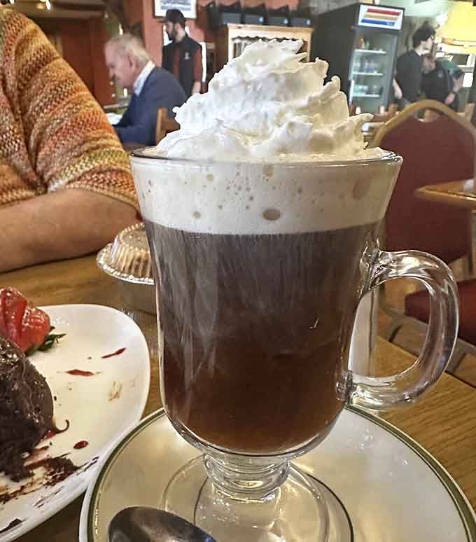 Irish coffee crowned with whipped cream peaks that rival Mount Everest, warming you from the inside out.