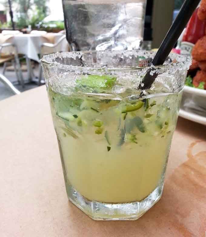 A refreshing mojito with a salted rim offers the perfect liquid companion to your meal, especially on hot Houston days.