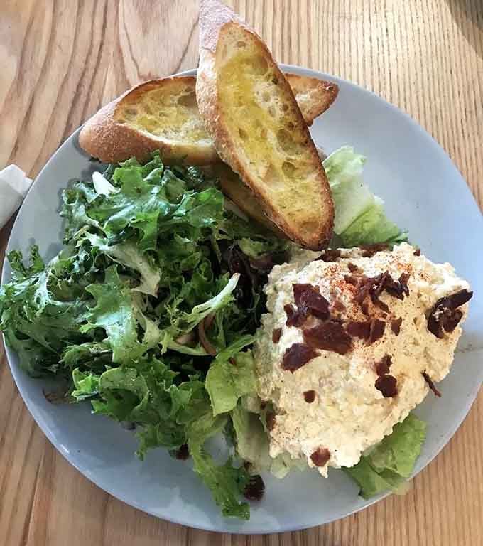 This isn't your sad desk lunch, it's egg salad elevated to an art form worth celebrating.