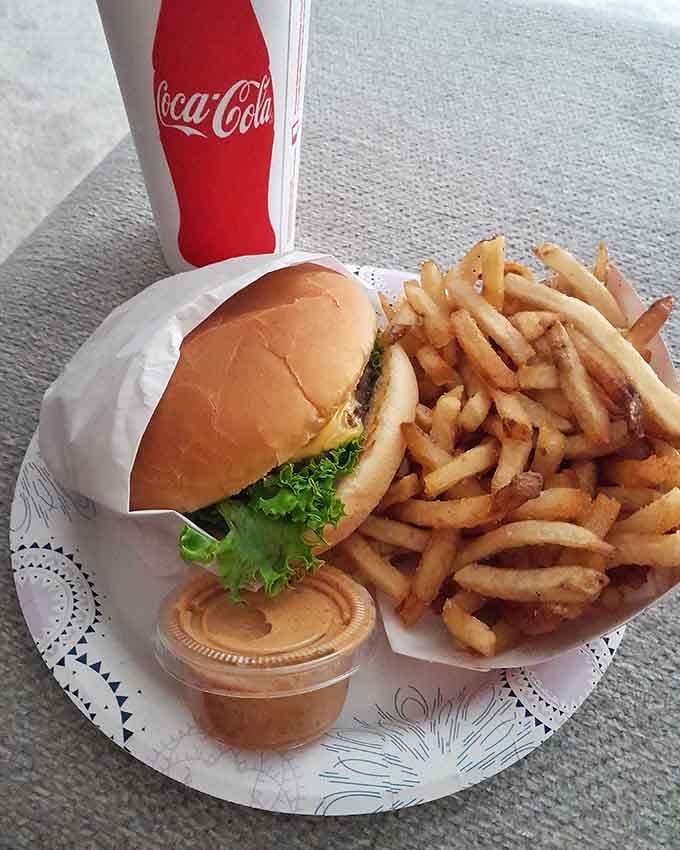 Classic burger, crispy fries, and Mexican Coke: the holy trinity of American comfort food done right.