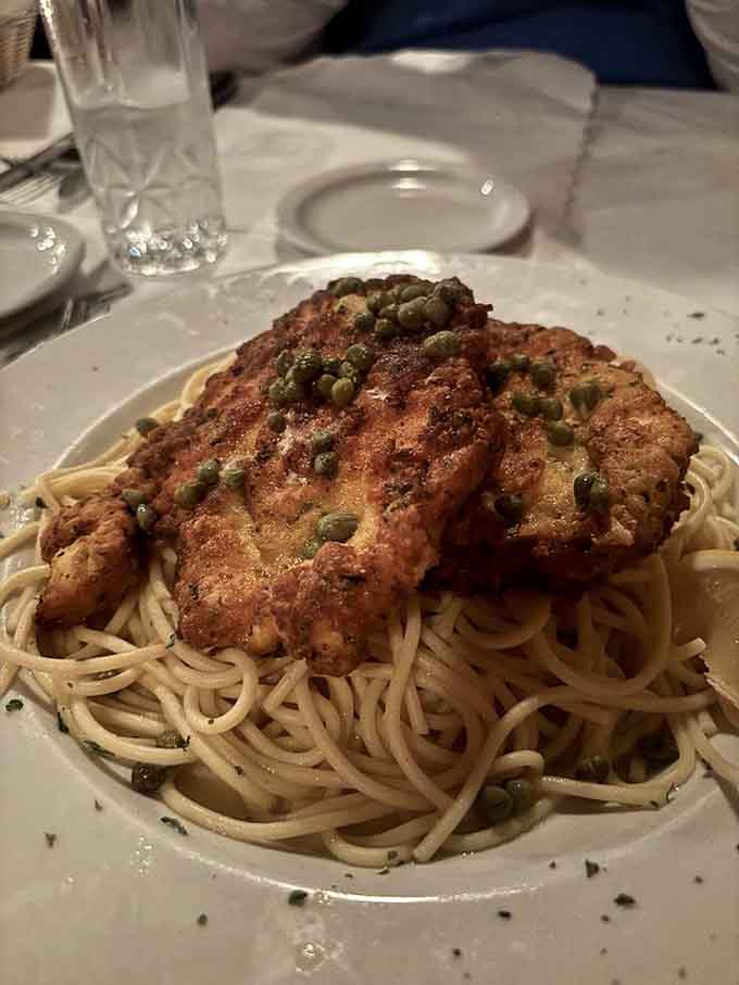 Golden lemon chicken over pasta offers a delicious detour for anyone taking a break from the beef parade.