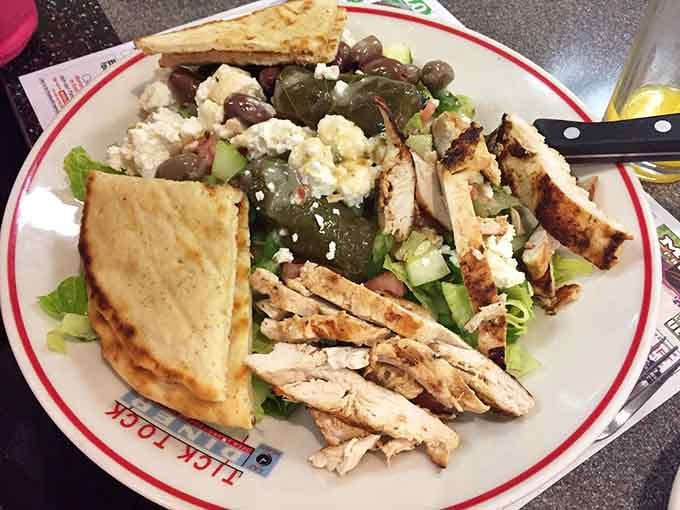 Fresh Greek salad loaded with grilled chicken, feta, and olives brings Mediterranean sunshine to your table any time you need it.