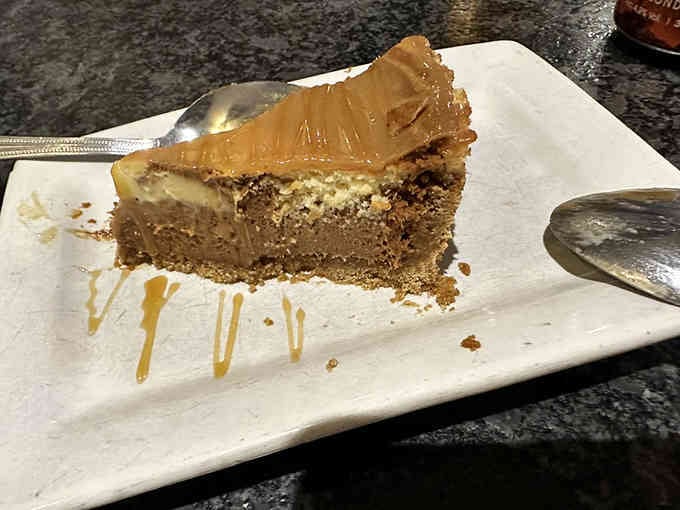 Salted caramel cheesecake: the sweet ending that makes you forget you ever claimed to be too full.