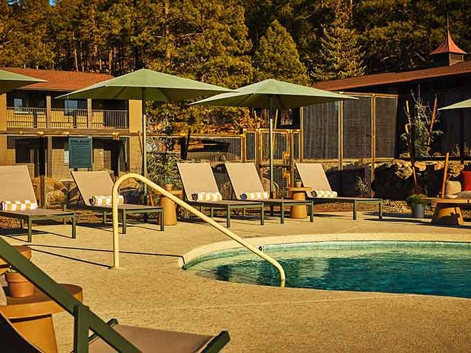 Pool loungers positioned perfectly for mountain views make it dangerously easy to skip your Grand Canyon plans entirely.