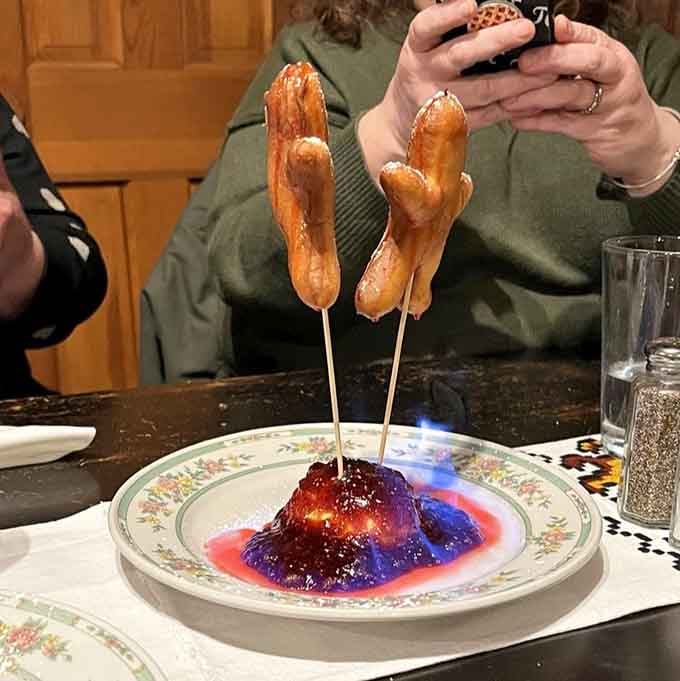 Flaming sausages on sticks make dinner feel like a medieval feast, minus the jousting but keeping all the fun.